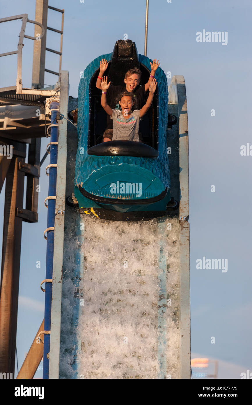 Landscape and portrait images of the midway, rides and games at an ...