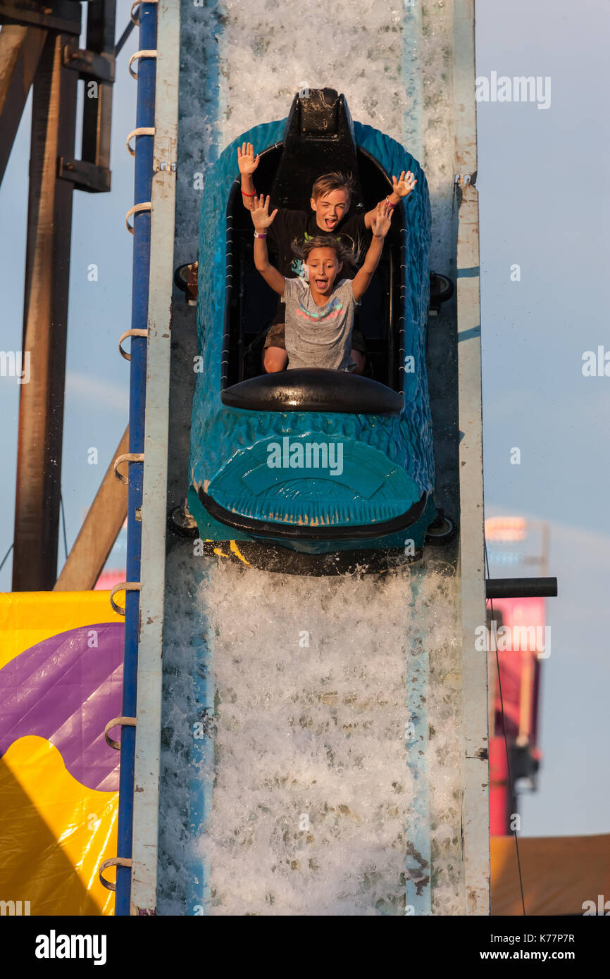 Landscape and portrait images of the midway, rides and games at an ...