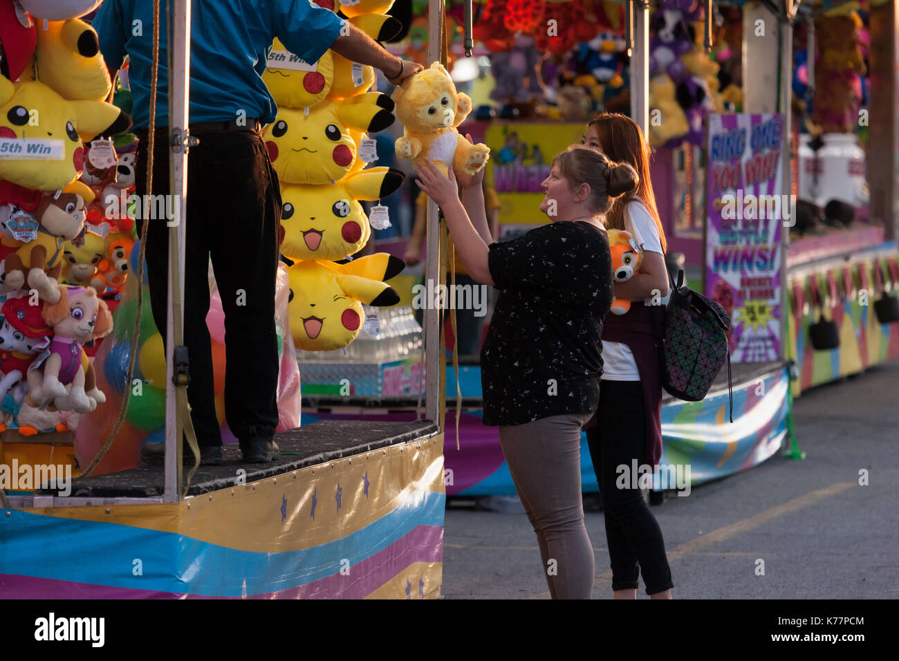 Landscape and portrait images of the midway, rides and games at an ...