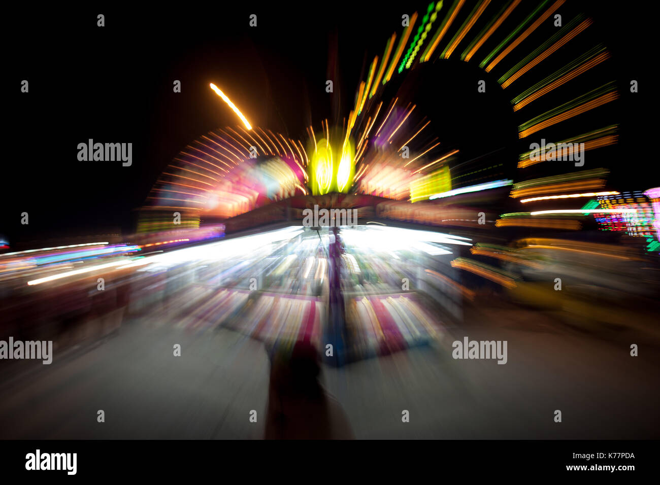 Landscape and portrait images of the midway, rides and games at an ...