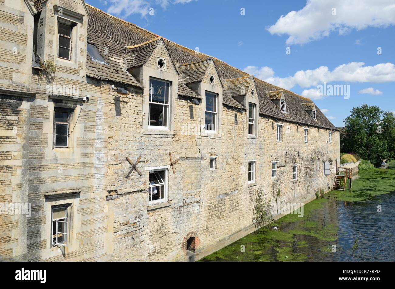 Old stone waterside warehouse Stock Photo - Alamy