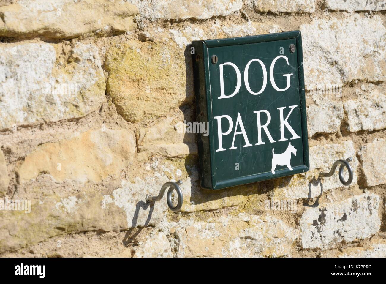 Dog lead hooks on wall Stock Photo - Alamy