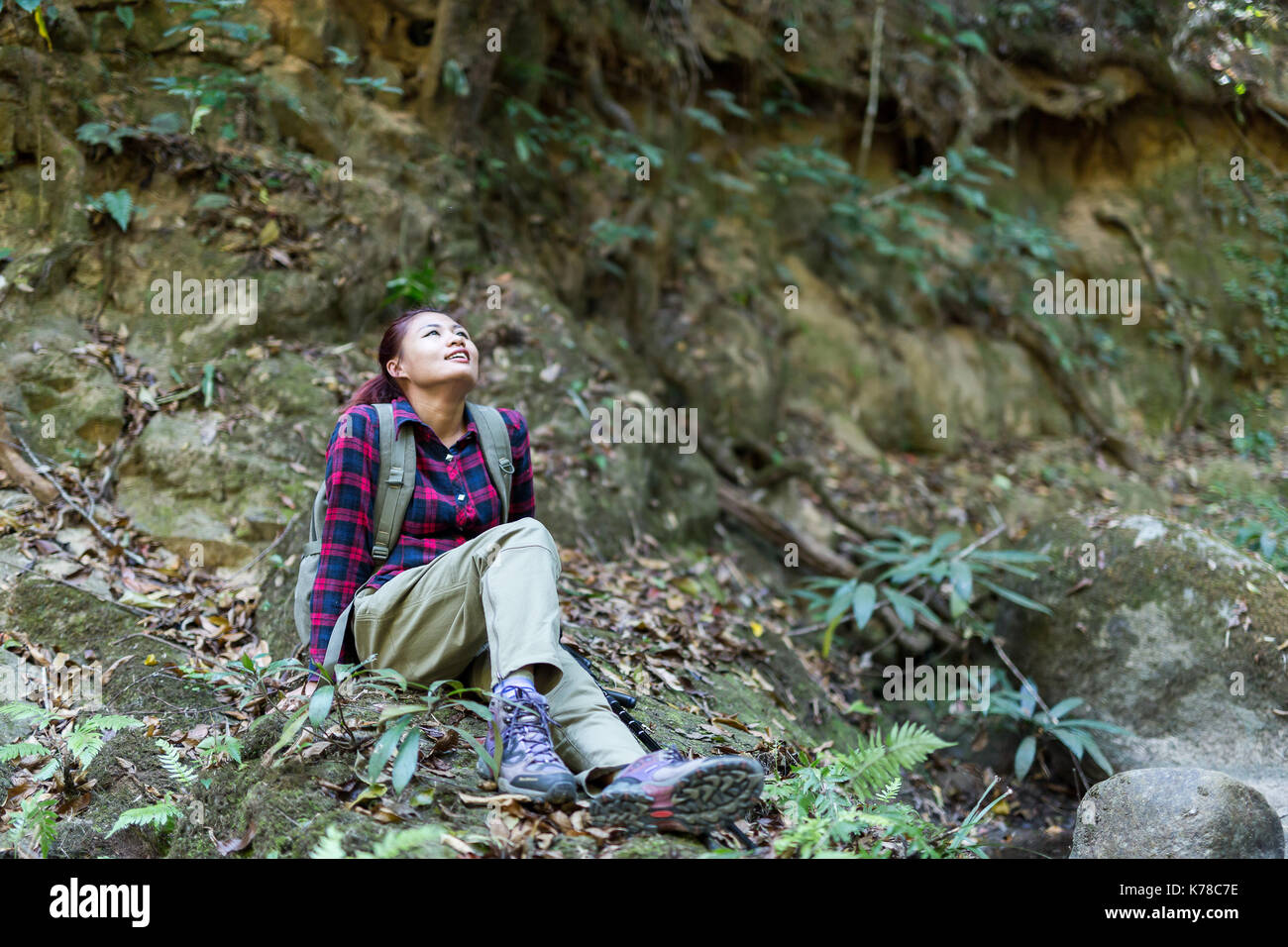 Hiking young woman with backpack watching trekking map, Hiking concept ...