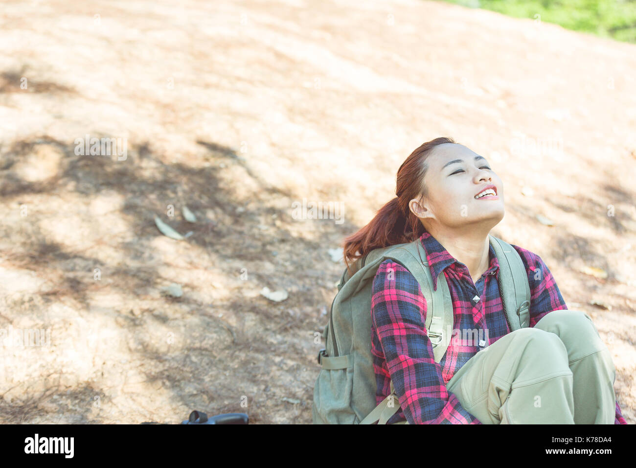 Hiking young woman with backpack watching trekking map, Hiking concept ...