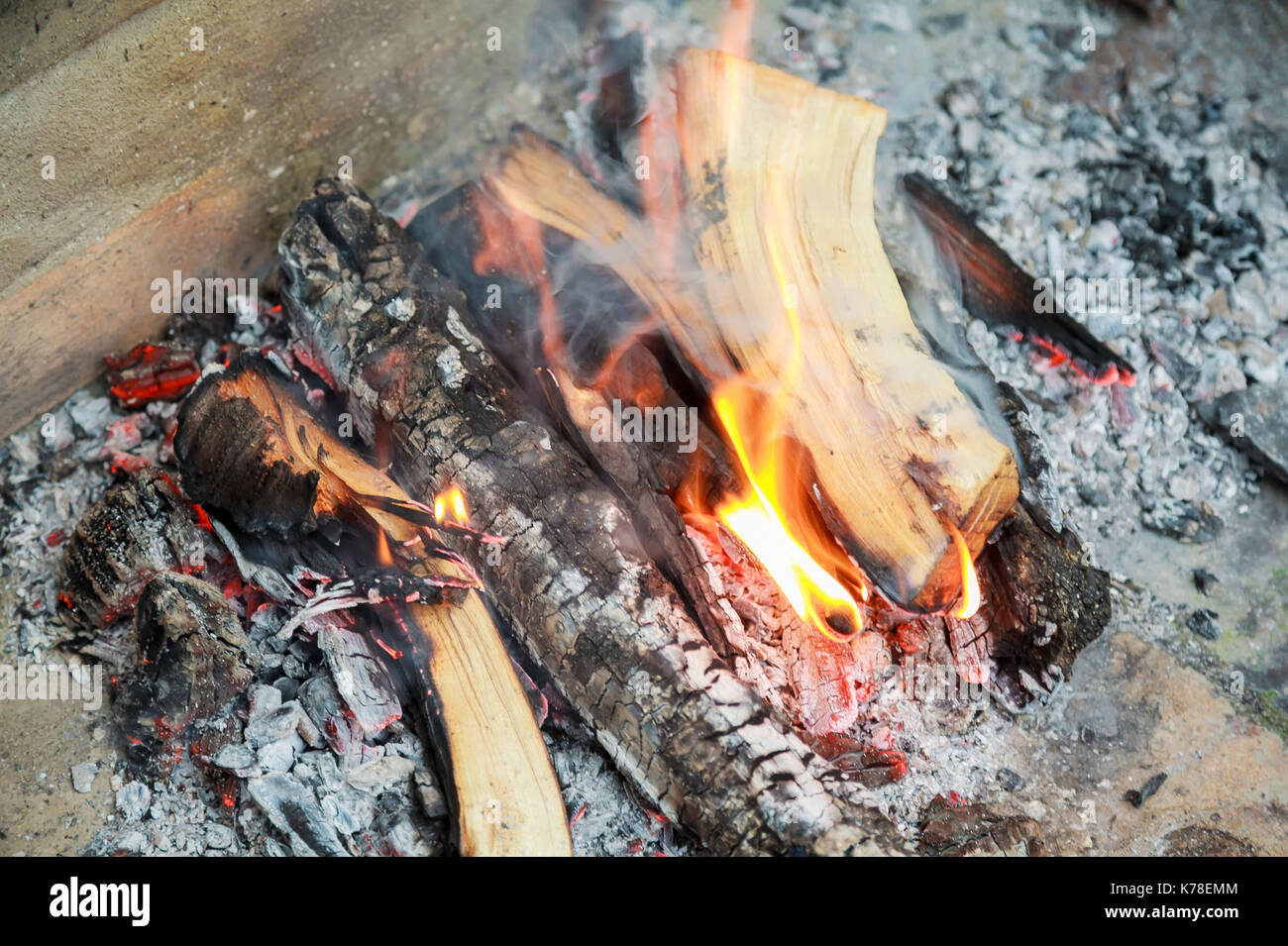 three burning billets in hot stove fire wood Stock Photo - Alamy