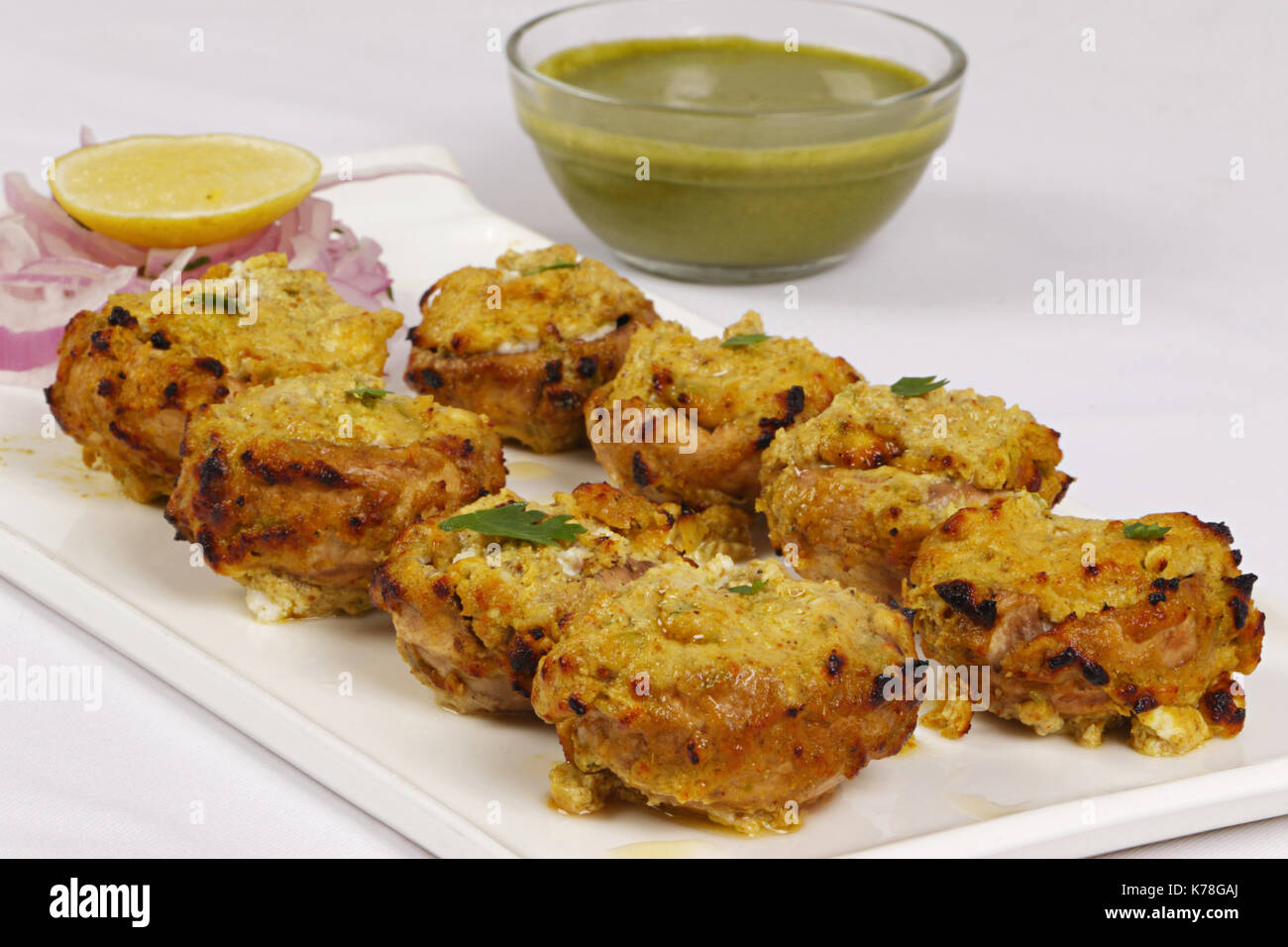 Chicken Kebab with mint sauce, lime and sliced onions Stock Photo - Alamy
