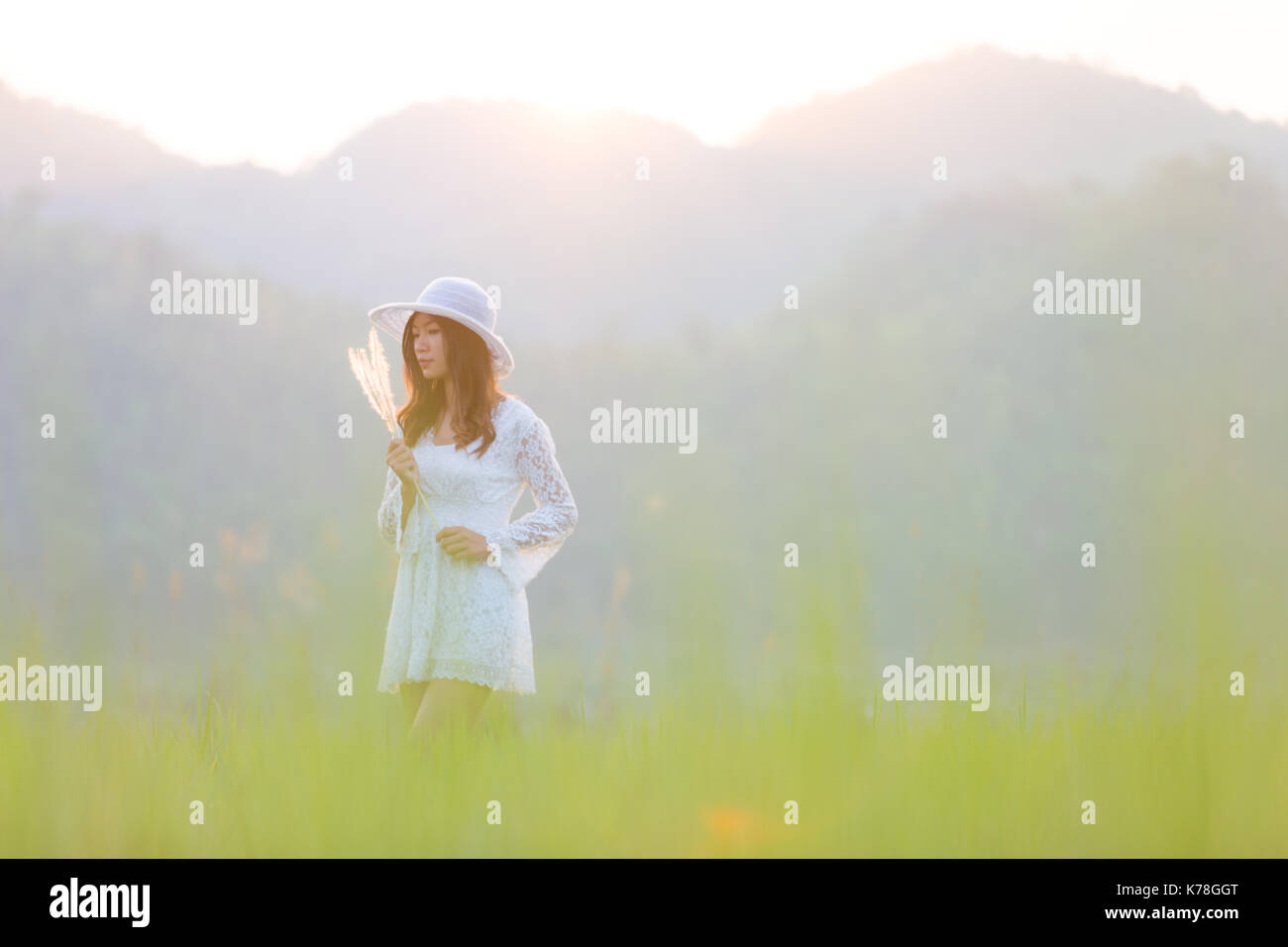 Happy girl in the meadow,Joy , sunlight , wheat Stock Photo - Alamy