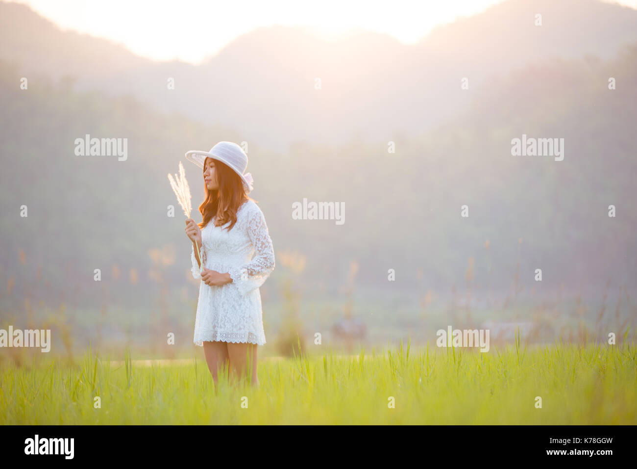 Happy girl in the meadow,Joy , sunlight , wheat Stock Photo - Alamy