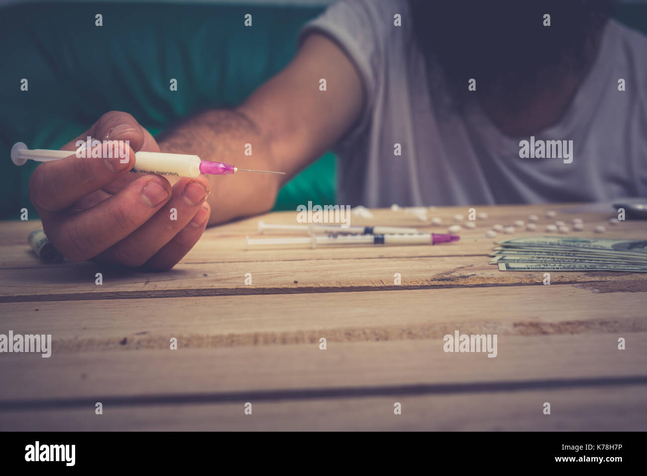 Drug addict young woman with syringe in action, Drug abuse concept ...
