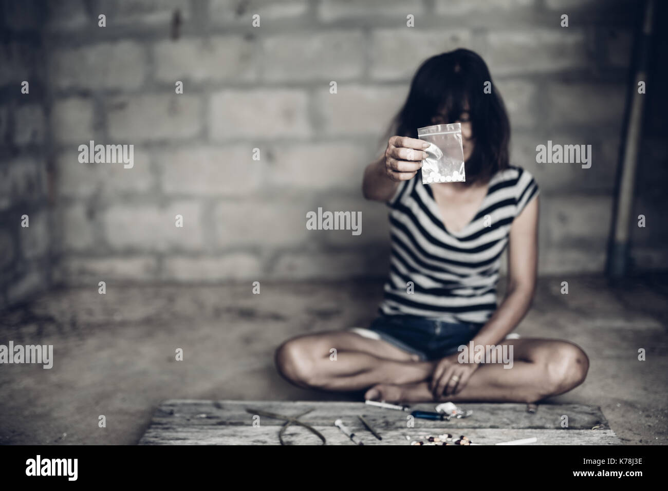 Drug addict young woman with syringe in action, Drug abuse concept ...