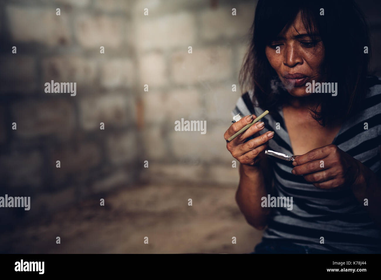 Drug addict young woman with syringe in action, Drug abuse concept ...