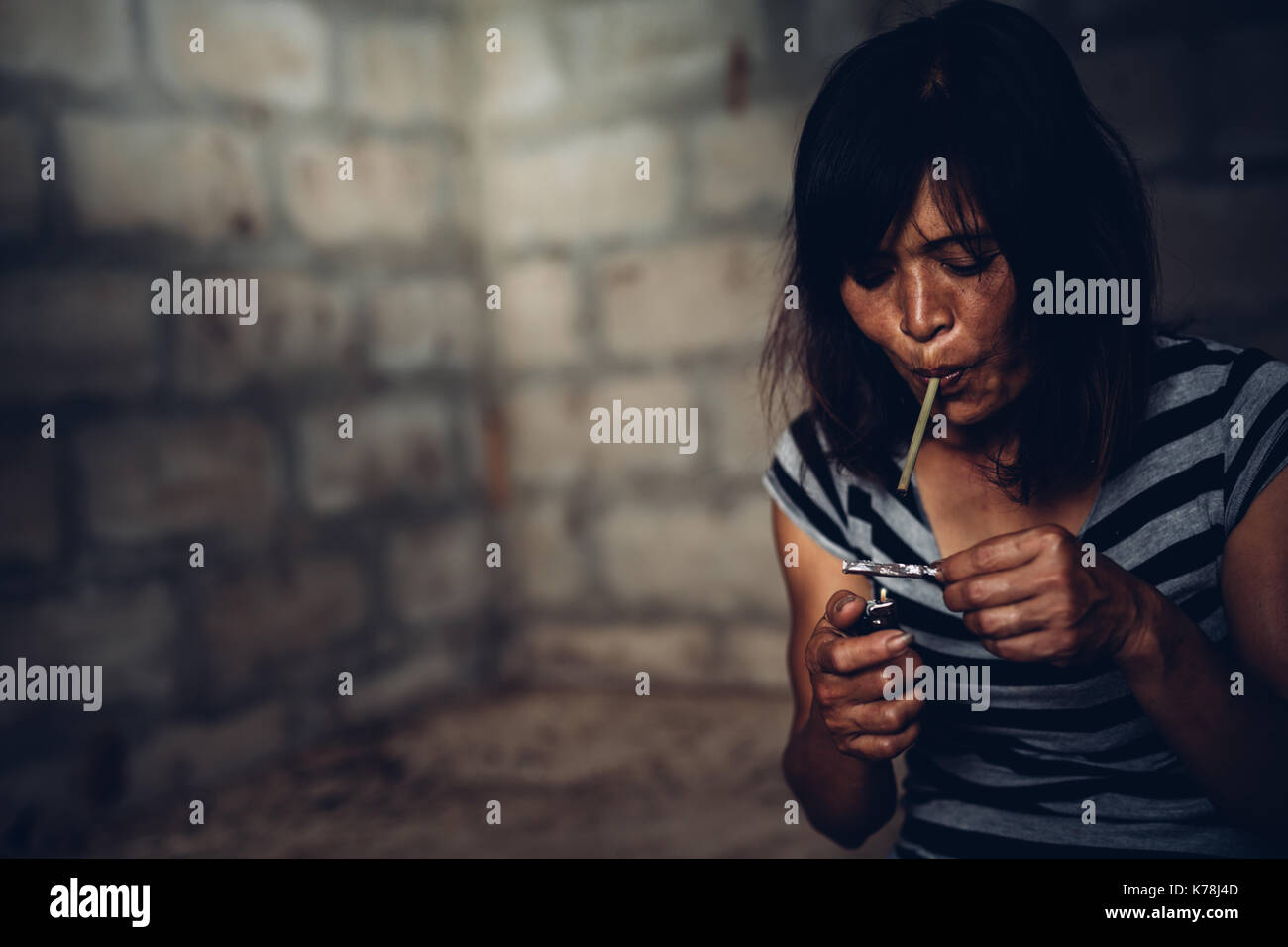 Drug addict young woman with syringe in action, Drug abuse concept ...