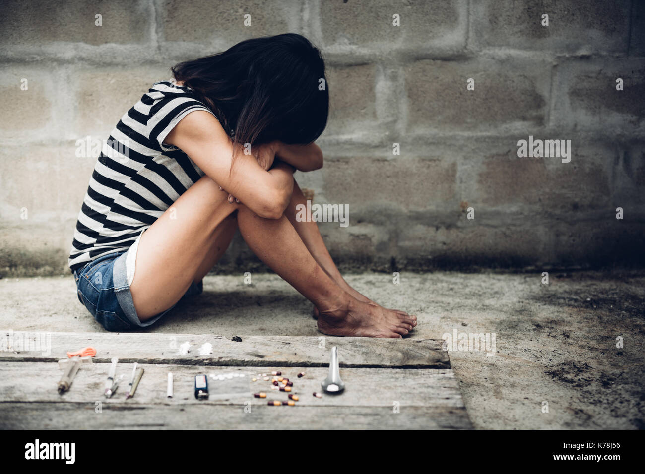Drug addict young woman with syringe in action, Drug abuse concept ...