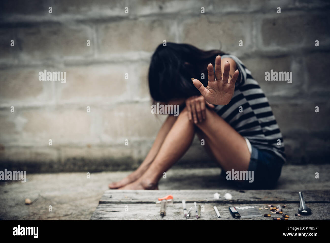 Drug addict young woman with syringe in action, Drug abuse concept ...