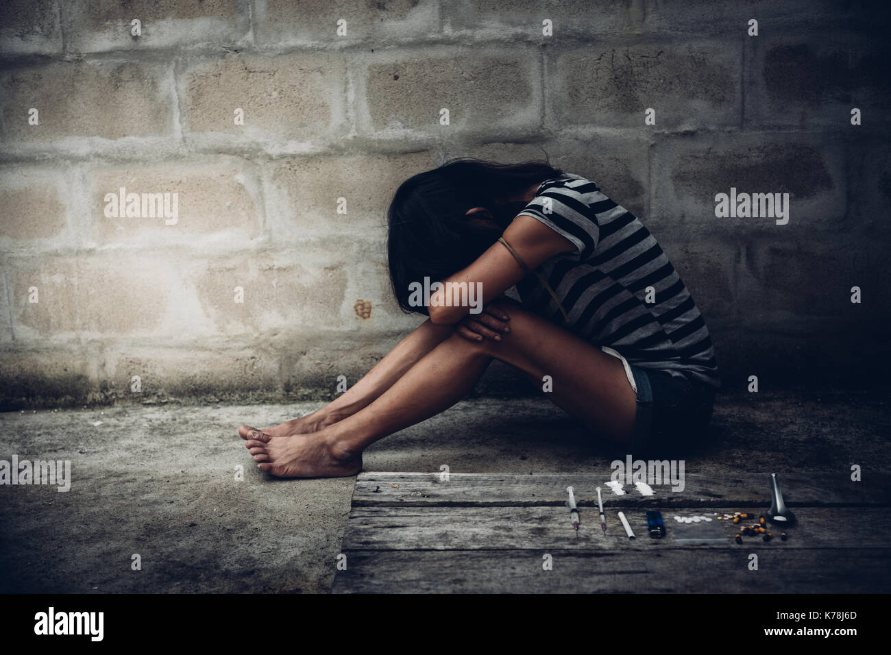 Drug addict young woman with syringe in action, Drug abuse concept ...