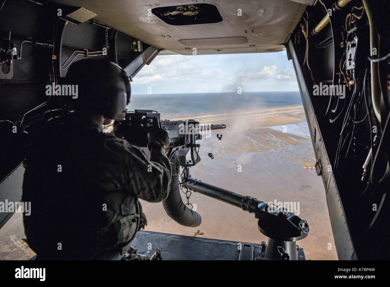 352d Special Operations Wing fires a .50 caliber machine gun aboard a ...