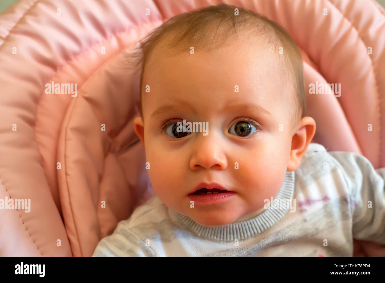 Curious baby while being feeded Stock Photo - Alamy Curious baby while being feeded Stock Photo - Alamy