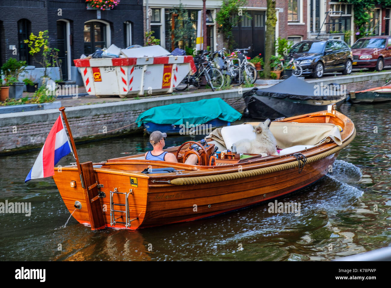 dutch boat on Amsterdam channel Stock Photo - Alamy