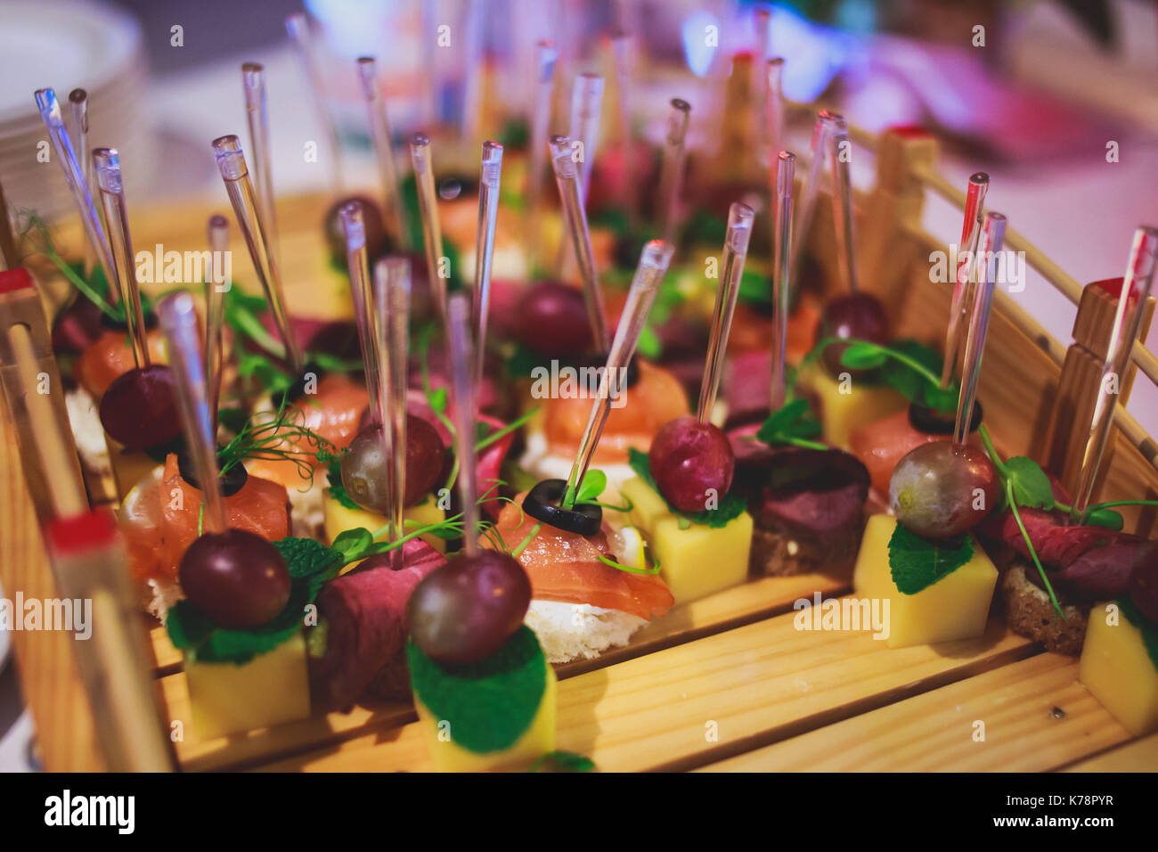 Beautifully decorated catering banquet table with different food snacks ...