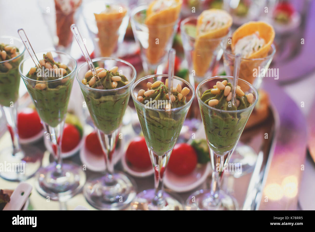 Beautifully decorated catering banquet table with different food snacks ...