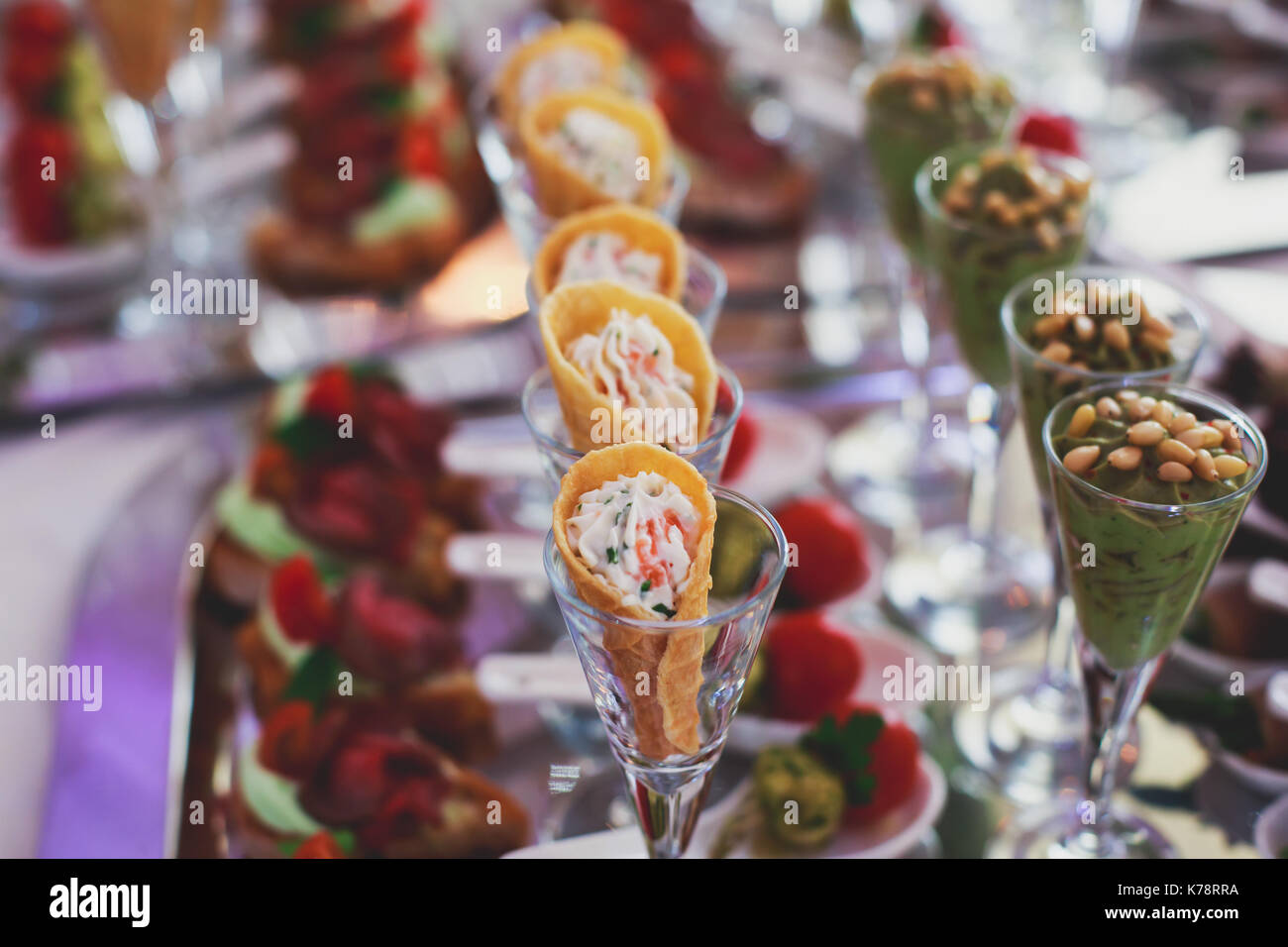 Beautifully decorated catering banquet table with different food snacks ...