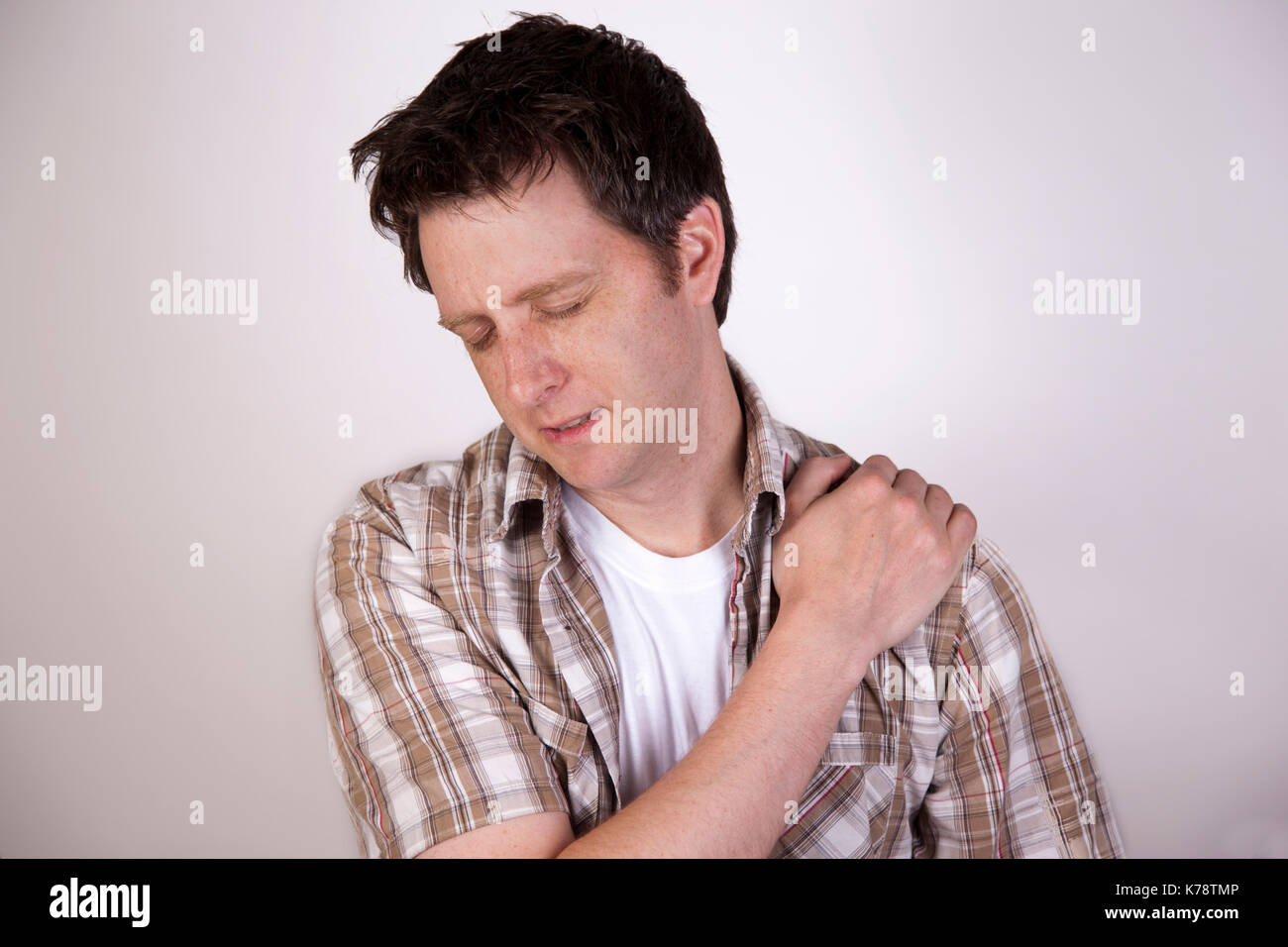 a man in quiet serious pain Stock Photo - Alamy