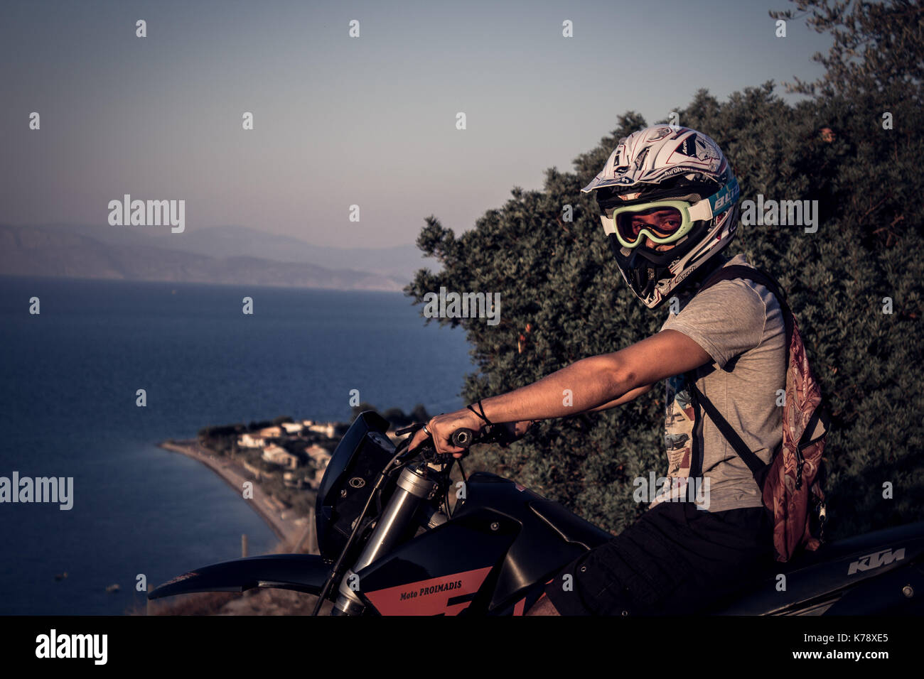 biker and his motorcycle on the edge of a cliff Stock Photo - Alamy