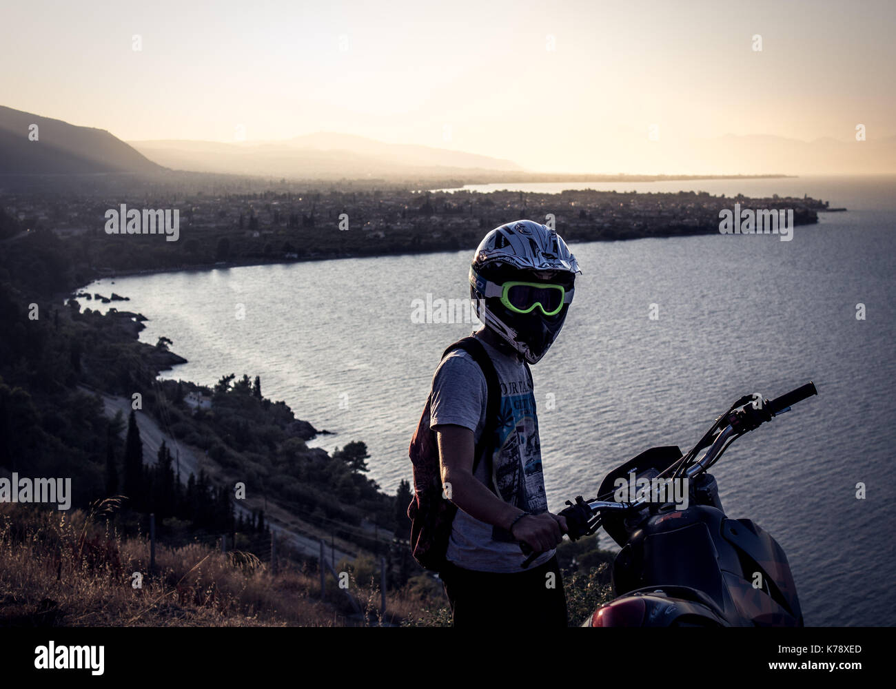 biker and his motorcycle on the edge of a cliff Stock Photo - Alamy