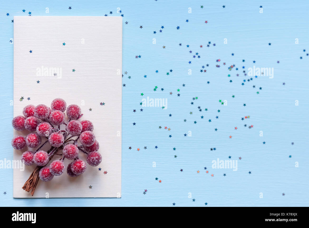 Light beige cards on a blue background with shiny stars and ornamental ...