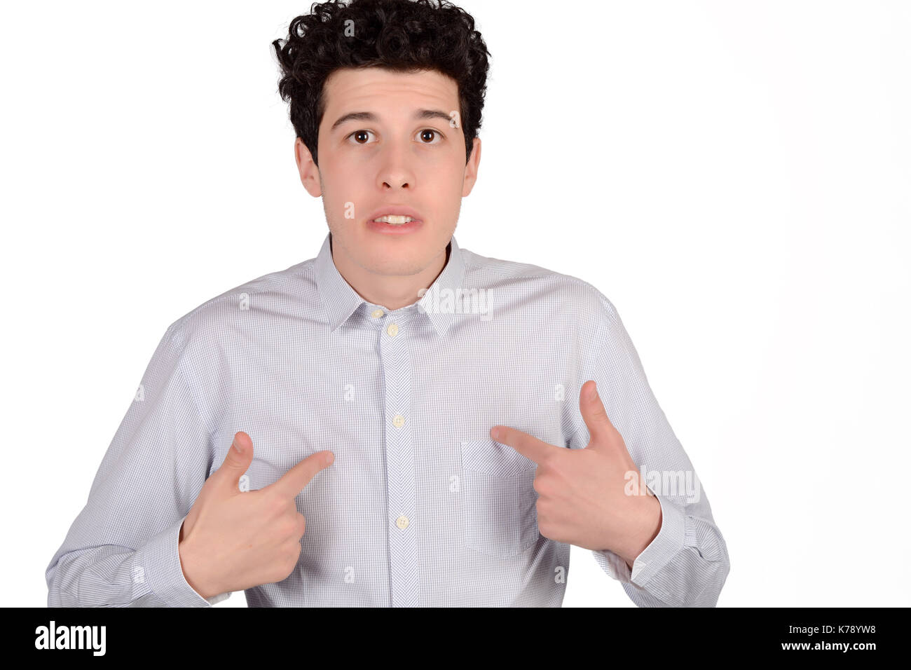 Portrait of young man pointing himself. Isolated white background Stock ...