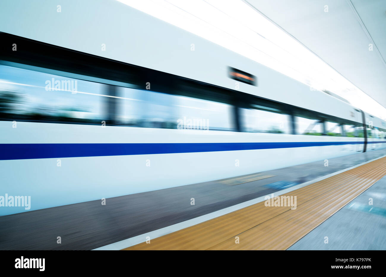 Dynamic high-speed train passing through the platform Stock Photo - Alamy