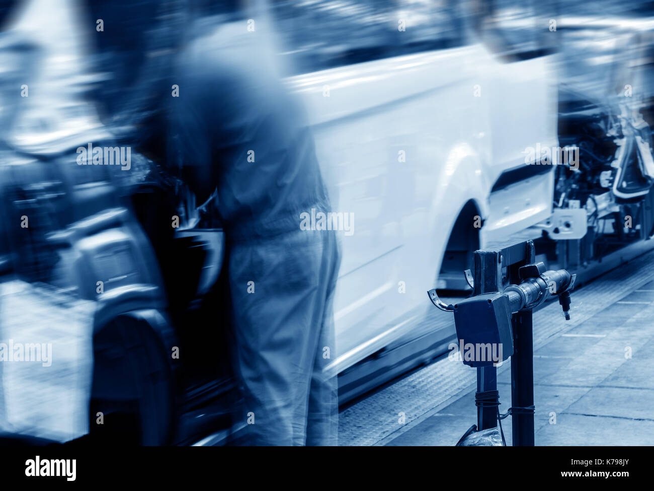 Car production line, skilled workers are working tense Stock Photo - Alamy