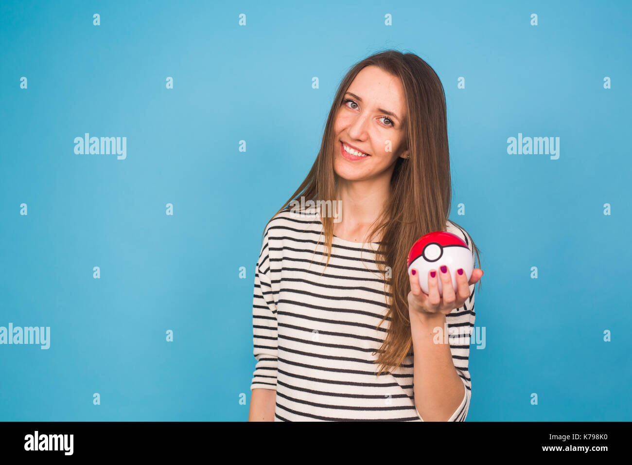 Ufa, Russia - July 8, 2017: woman holding pokeball with pikachu ...
