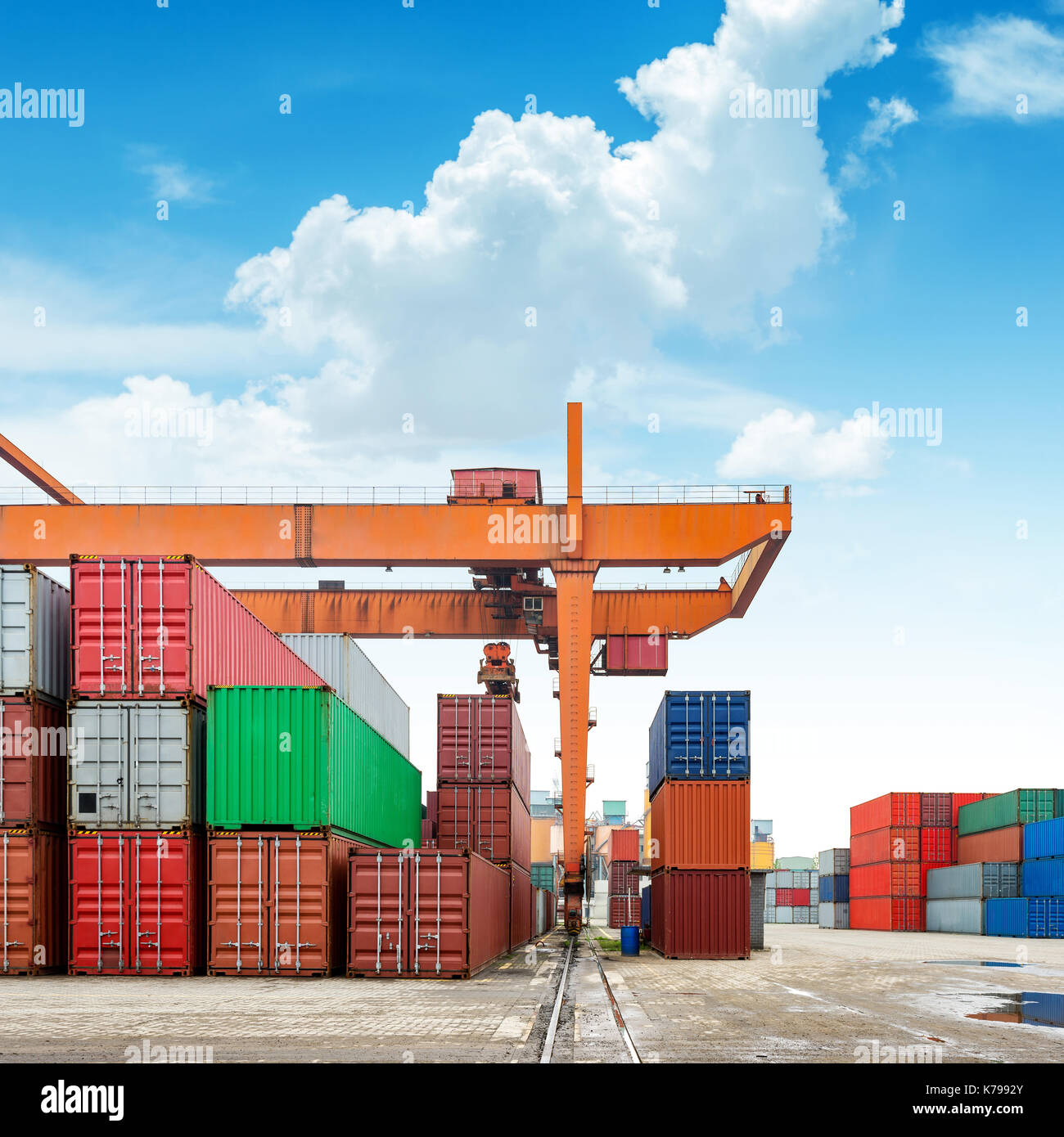 Blue sky and white clouds under the container terminal Stock Photo - Alamy