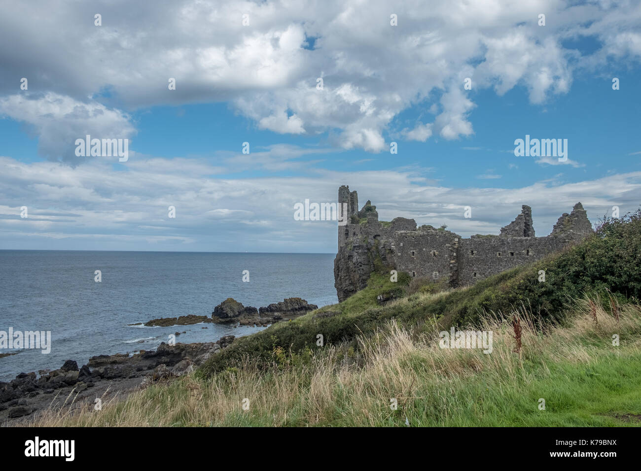 Landscape view of Dunure Scotland looking over the sea with ruins in ...