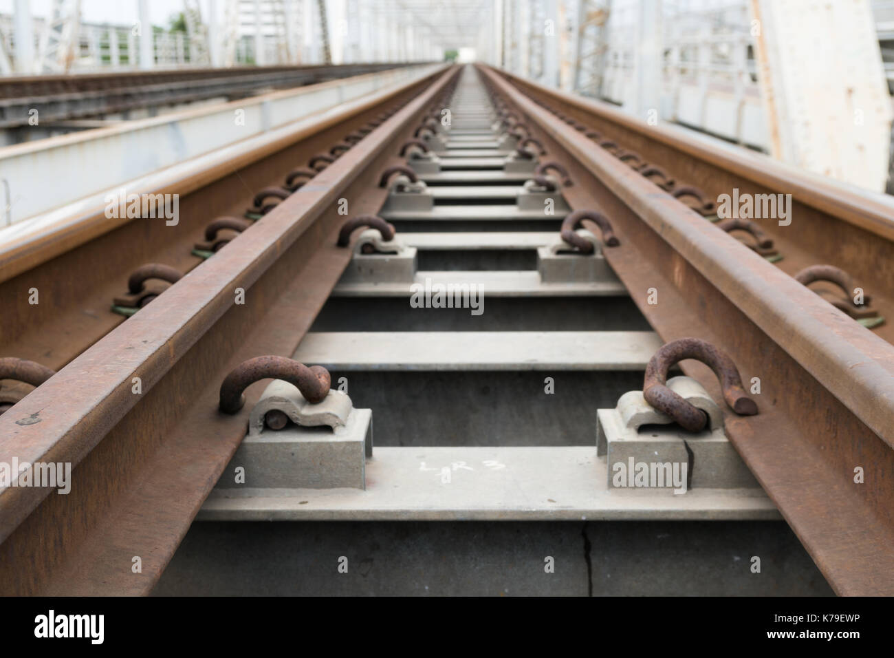 old iron white bridge and railway line Stock Photo - Alamy