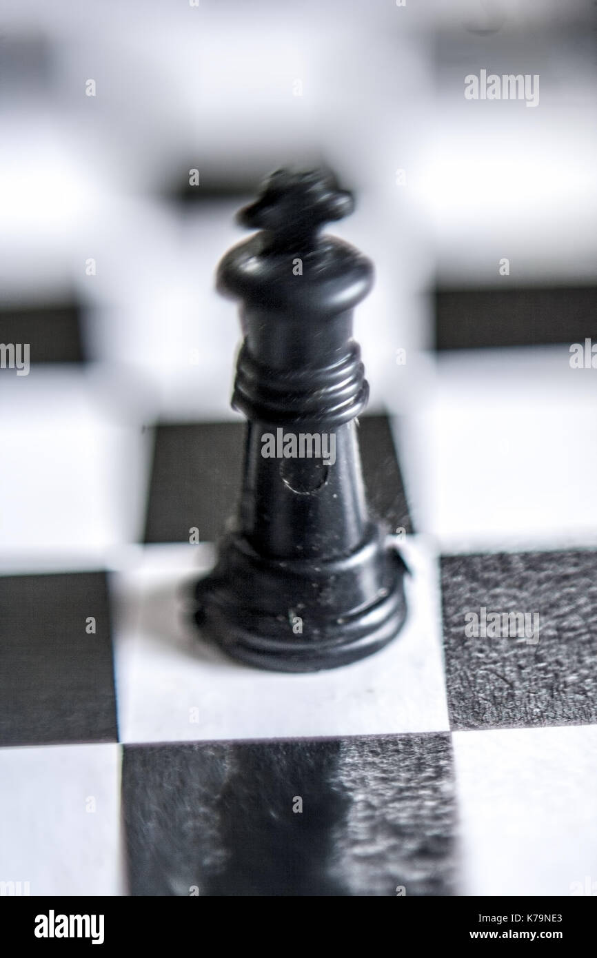 Black queen down on the chess board Stock Photo - Alamy