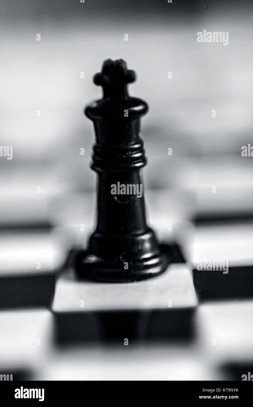 Black queen down on the chess board Stock Photo - Alamy