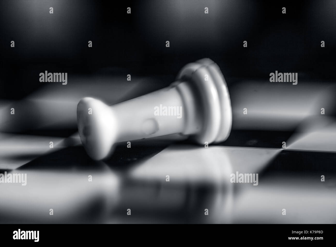 A white rook fallen on the chess board Stock Photo - Alamy