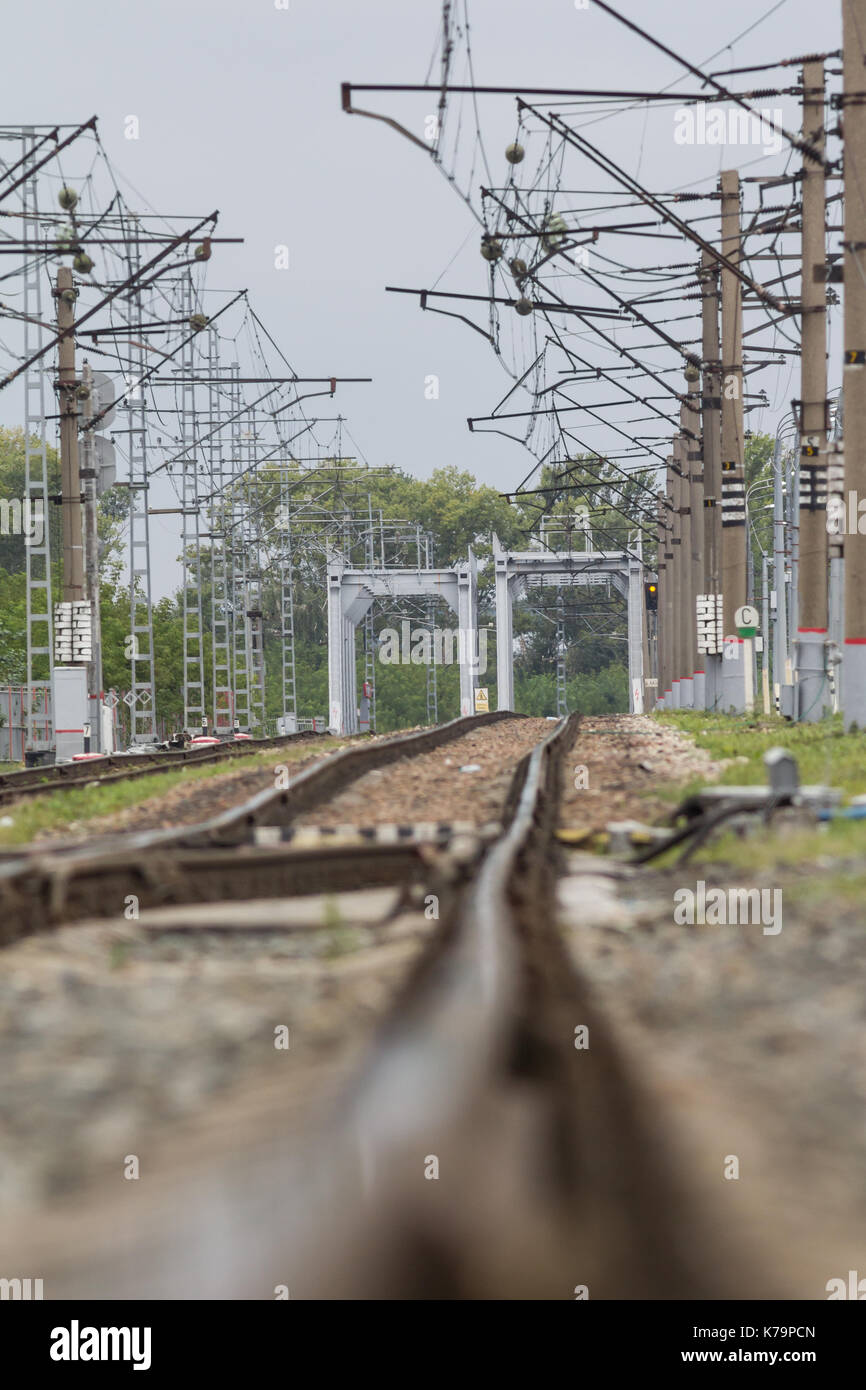 Curving railway metal tracks, vertical Stock Photo - Alamy