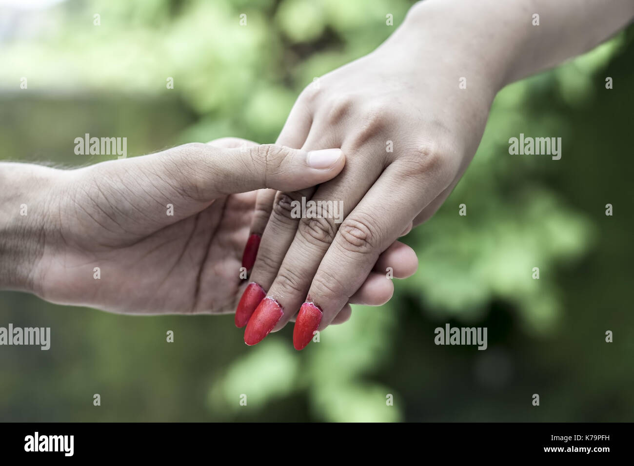 Helping hand offered to female Stock Photo - Alamy