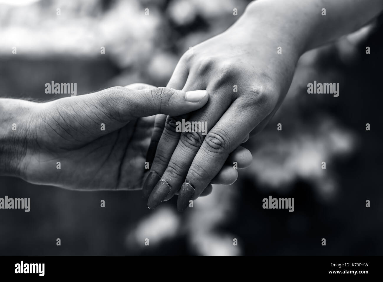 Helping hand offered to female Stock Photo - Alamy