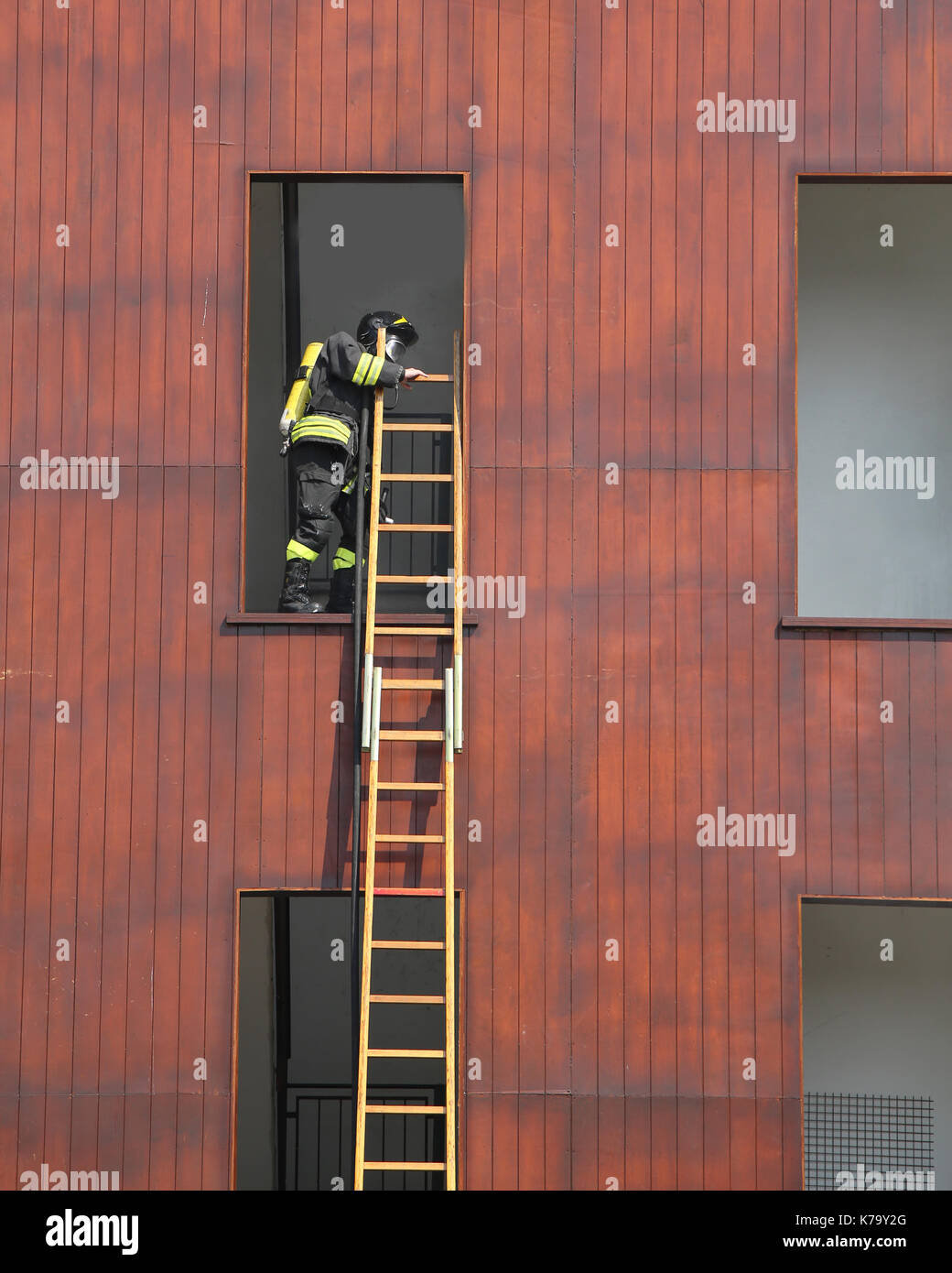firefighter exercise while climbing in the fire station building Stock ...