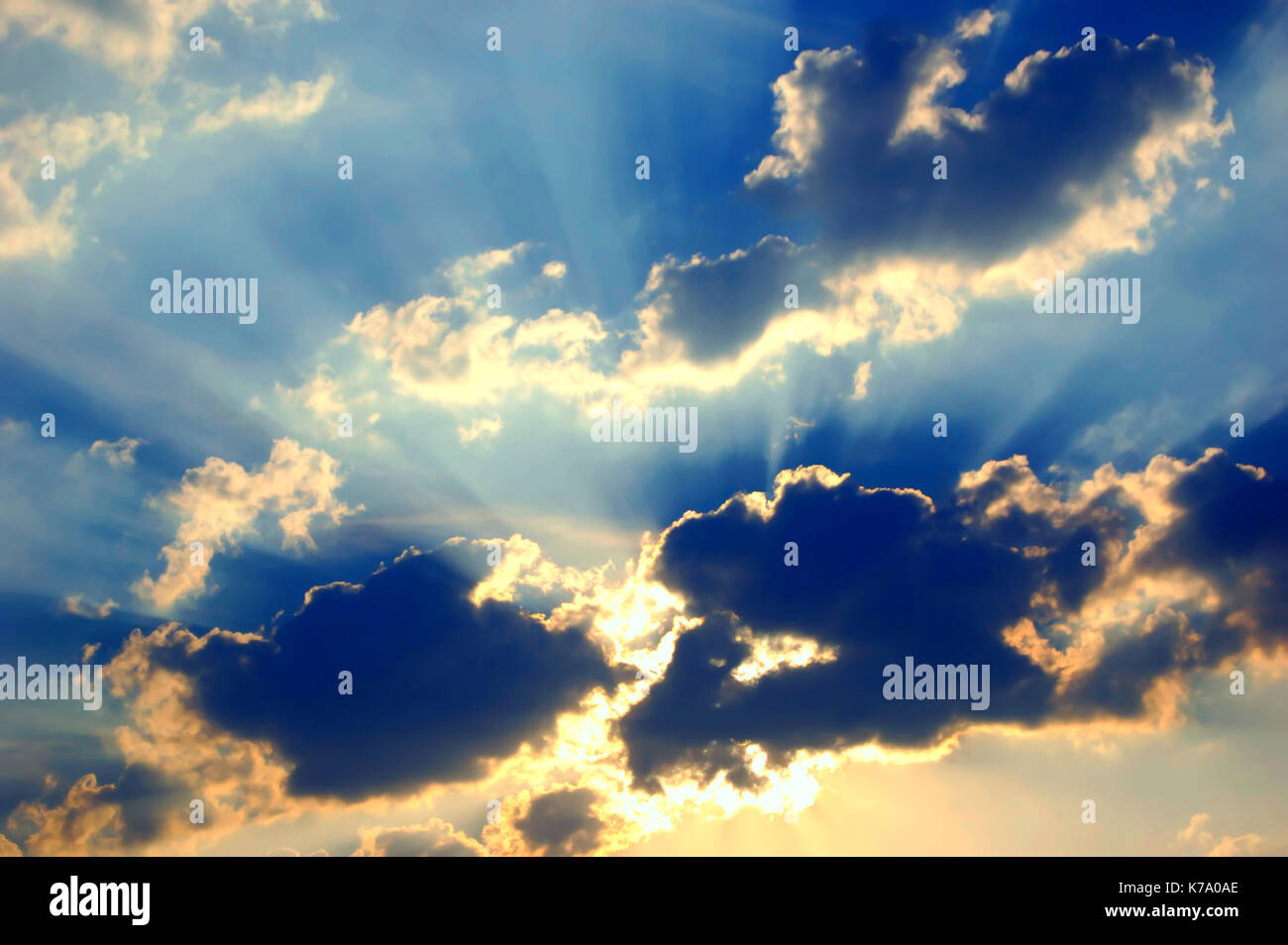 mystical sky with rays of light from behind clouds Stock Photo - Alamy