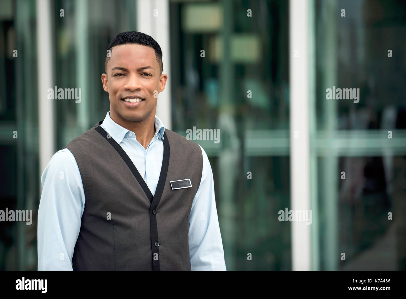 Hotel bellhop, portrait Stock Photo - Alamy