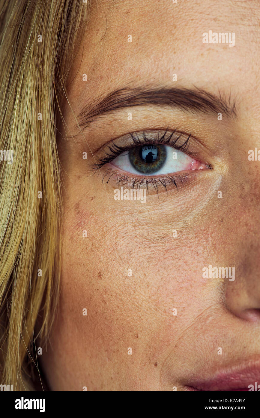Close-up of woman's face and eye Stock Photo - Alamy