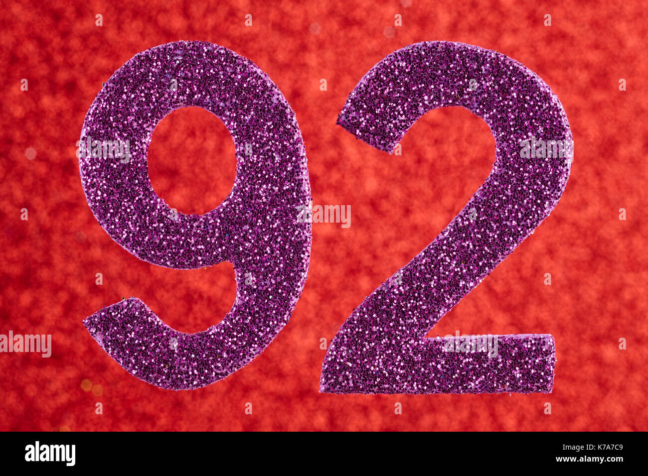 Number ninety-two purple color over a red background. Anniversary ...