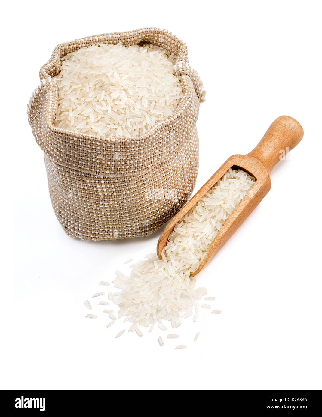 Scoop with parboiled rice and burlap sack filled rice isolated on white ...
