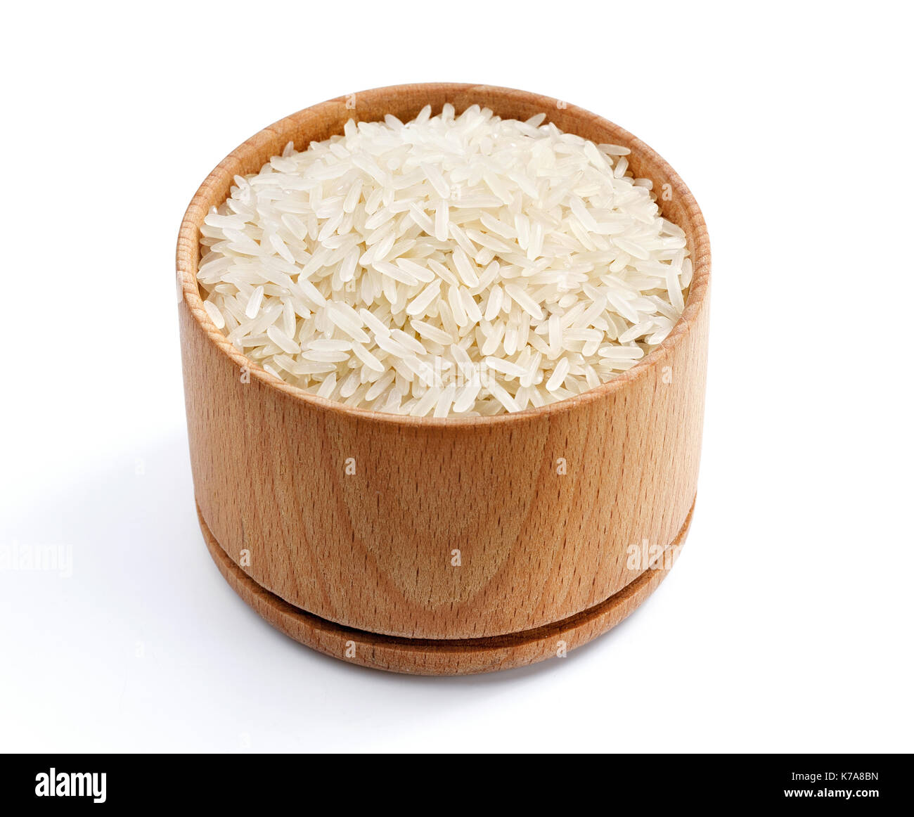 Healthy food. Parboiled rice in wooden bowl isolated on white ...
