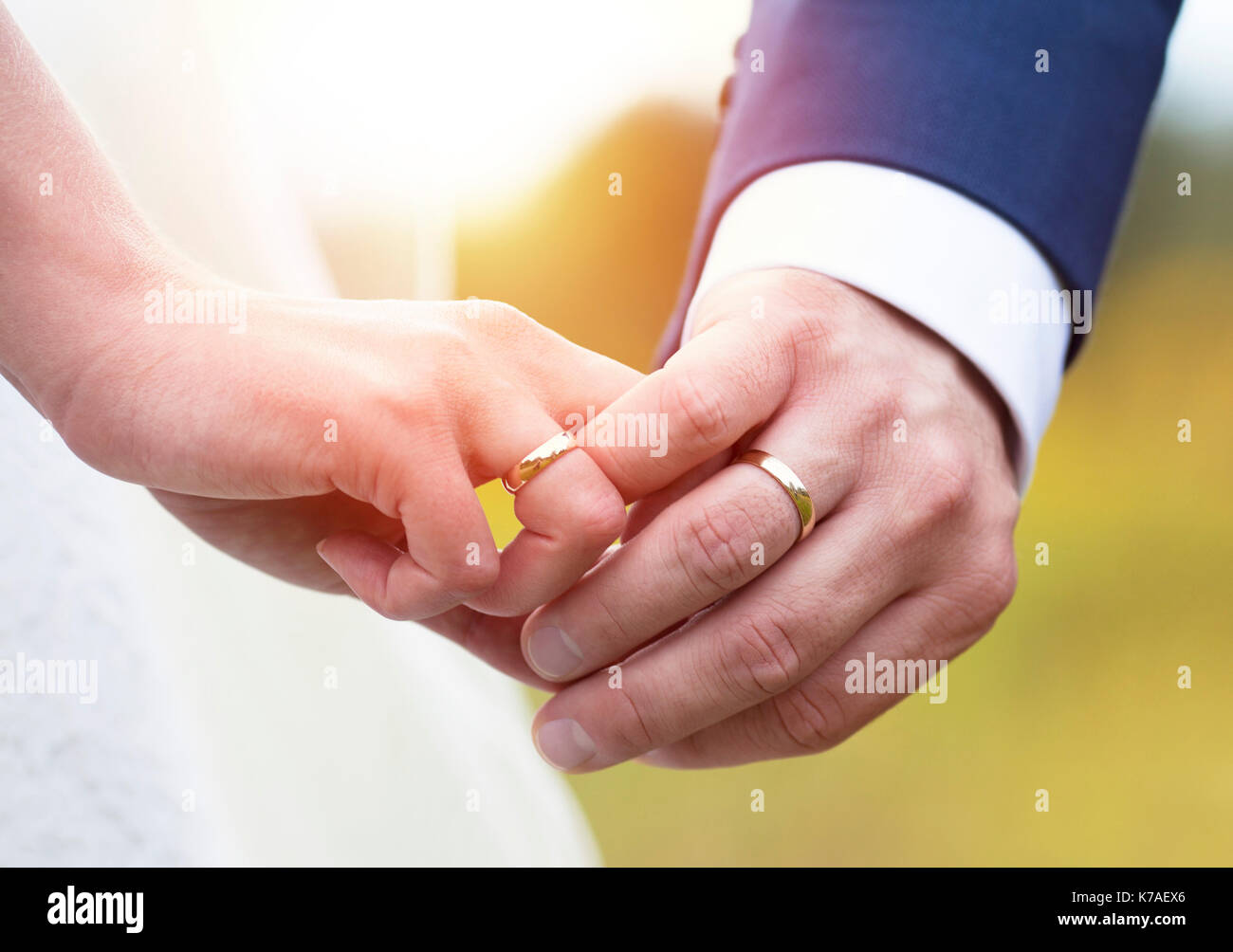 Wedding couple holding hands Stock Photo - Alamy